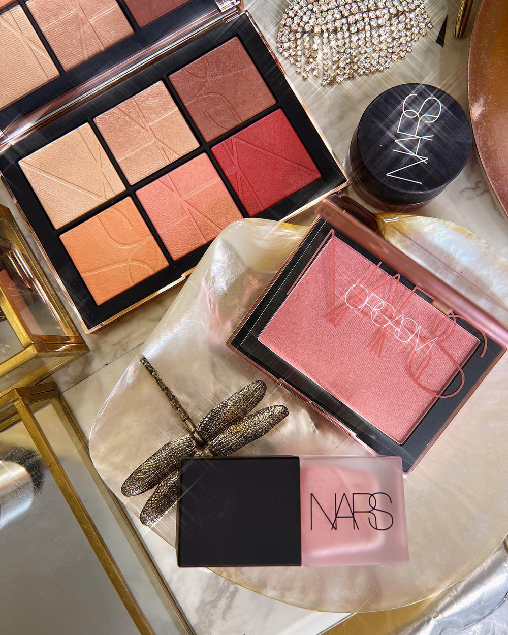 The iconic peachy pink hue... – The Beauty Edit